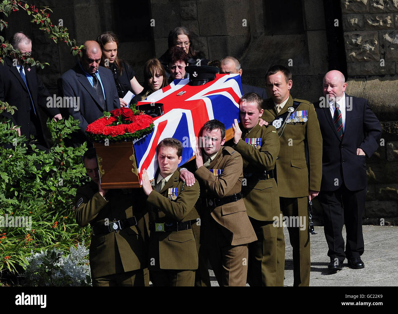 The coffin of Rifleman Daniel Wild is carried during the funeral at St ...