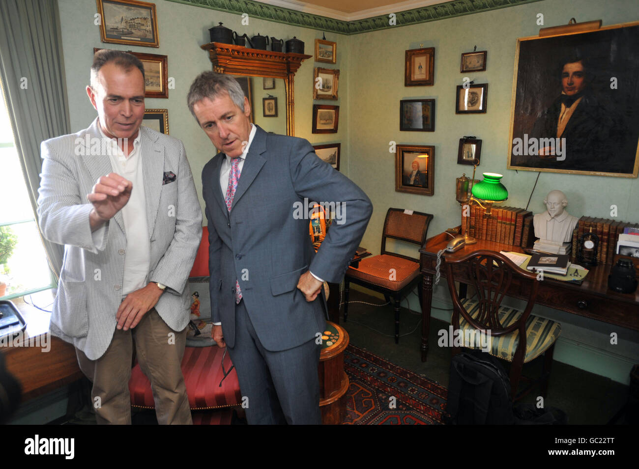 Actor and comedian Griff Rhys Jones (right) speaks to home owner Craig ...