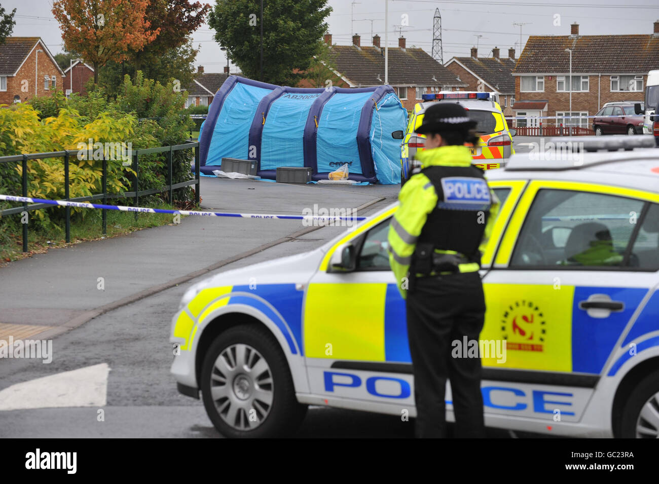 Police officers attend the scene in Luton after a man was found shot ...