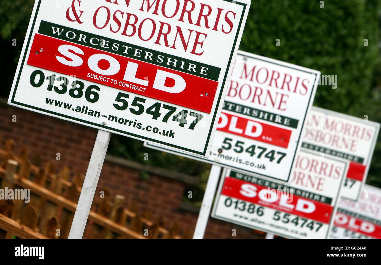 A row of for sale boards show the 'sold' sign in Pershore ...