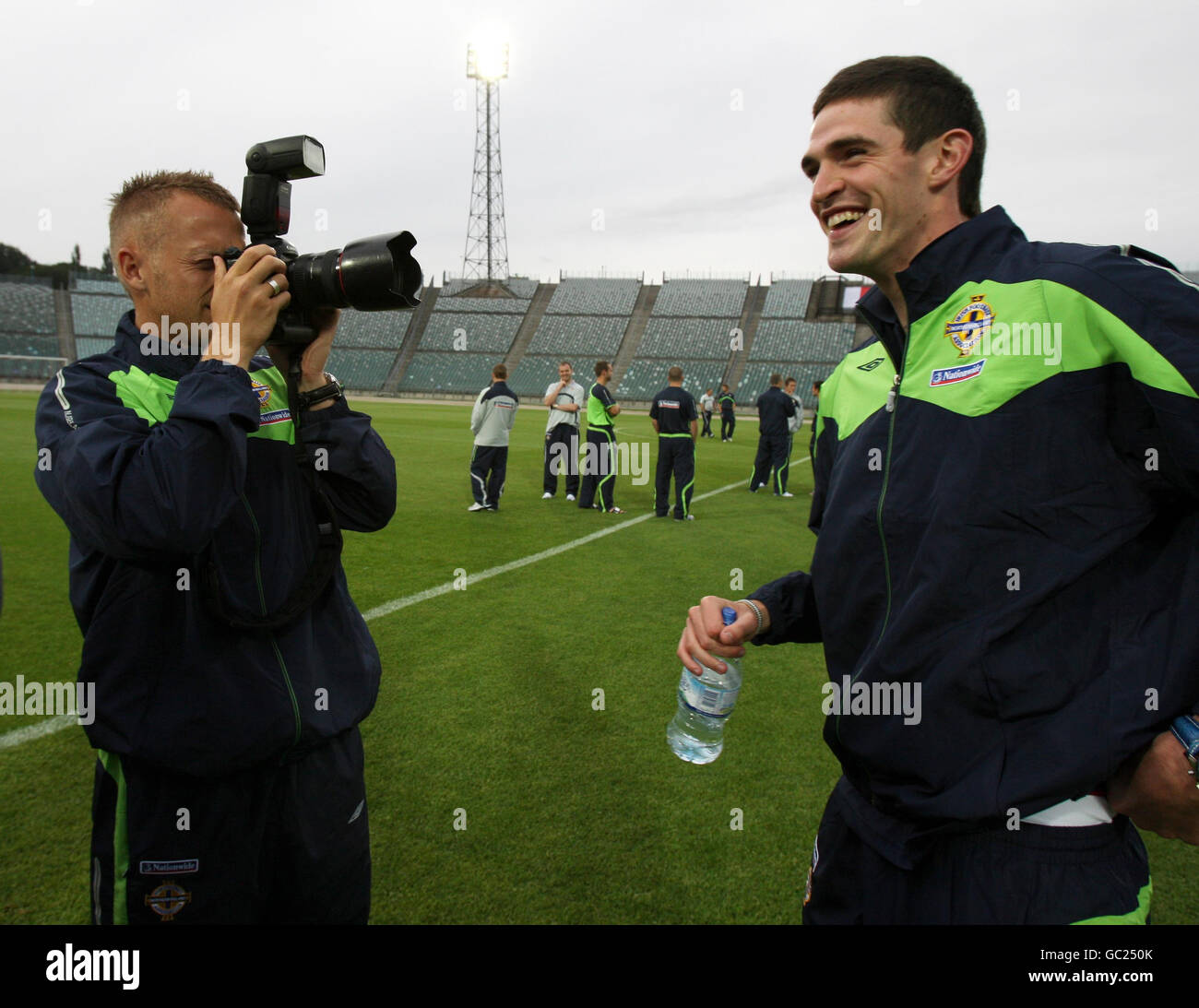 Northern Ireland's Sammy Clingan uses a press photographer's camera to ...