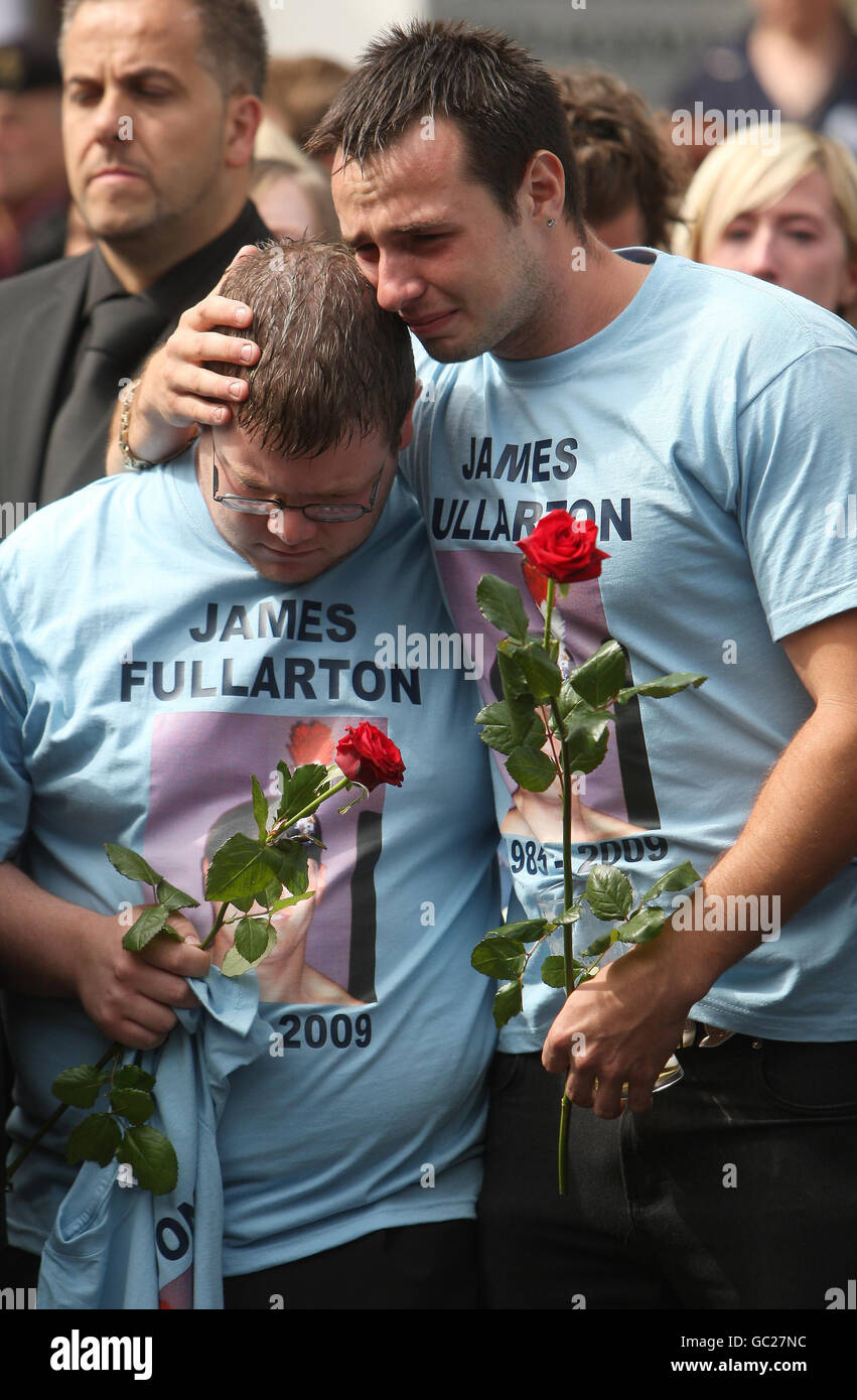 Mourners comfort each other on the streets of Wootton Bassett ...