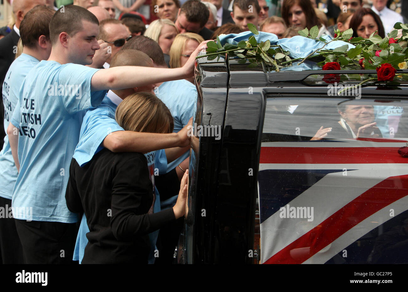Mourners comfort each other on the streets of Wootton Bassett ...