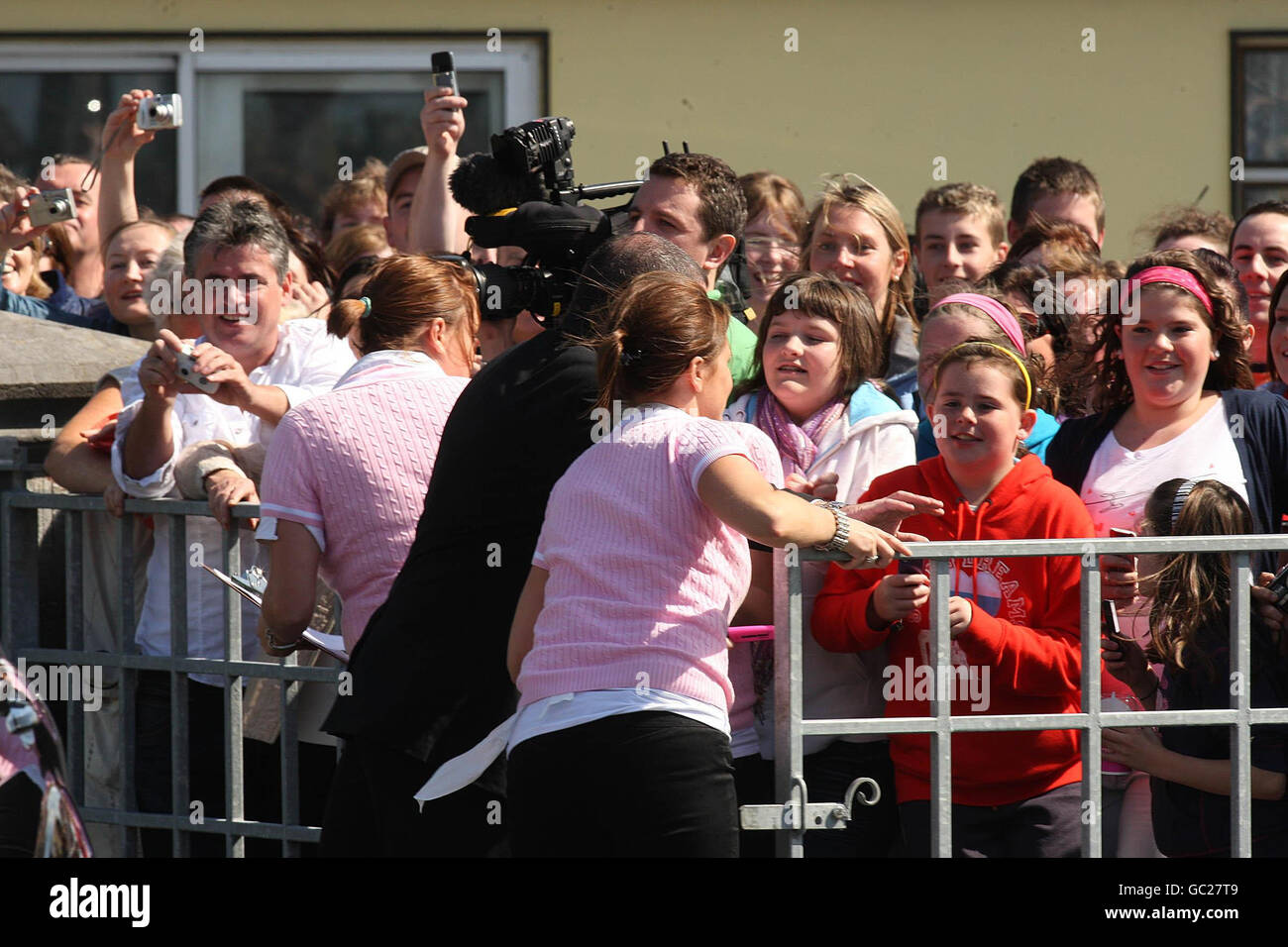Crowds gather to try to catch a glimpse of the wedding of Andrea Corr ...