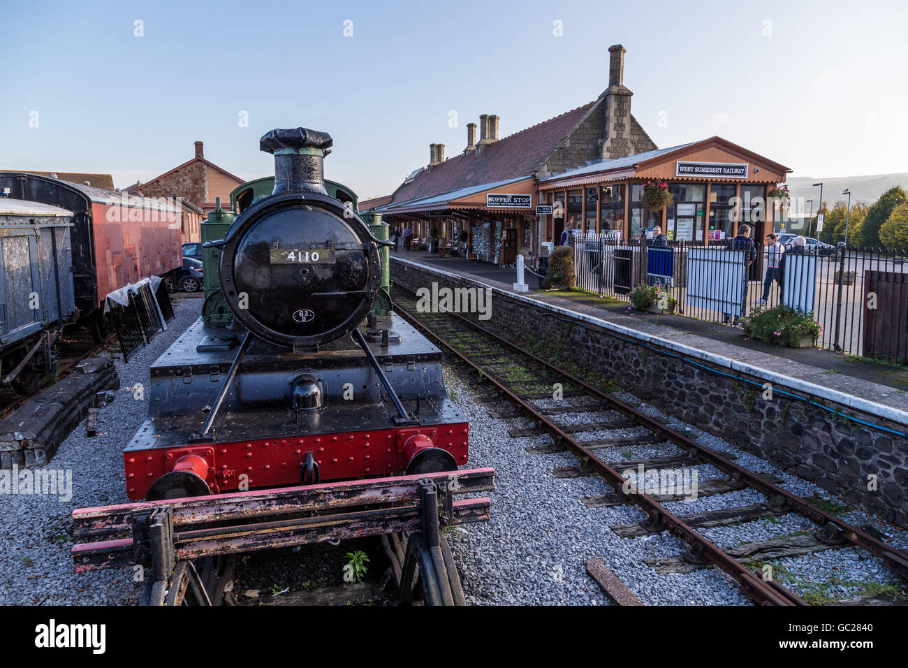 A steam train at the end of the line terminal at Minehead Station ...