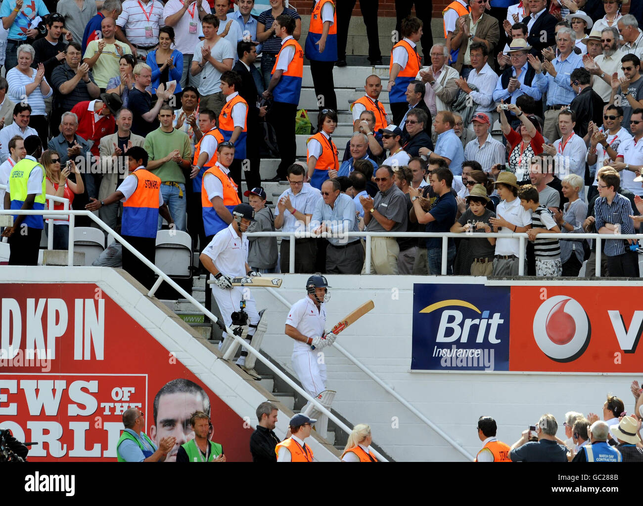 Andrew Strauss (right) and Jonathon Trott make their way onto the field ...