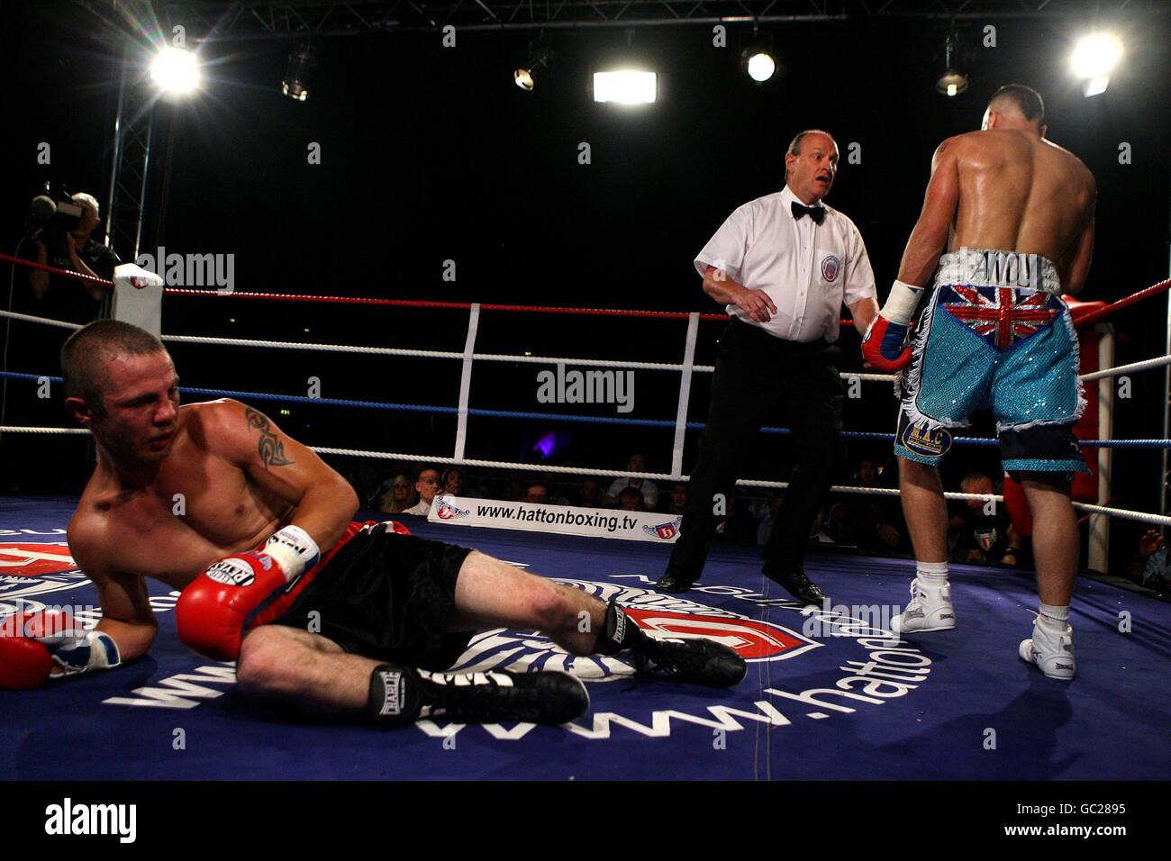 Andy Morris knocks down Jesus Garcia Simon during the Ricky Hatton ...