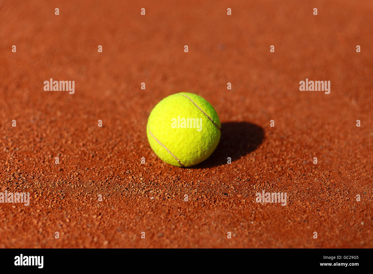 tennis court with tennis ball and antuka background Stock Photo - Alamy