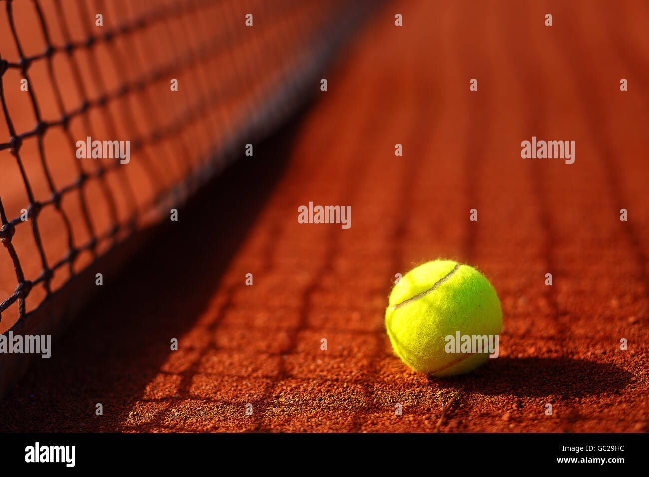 tennis court with tennis ball and antuka background Stock Photo - Alamy