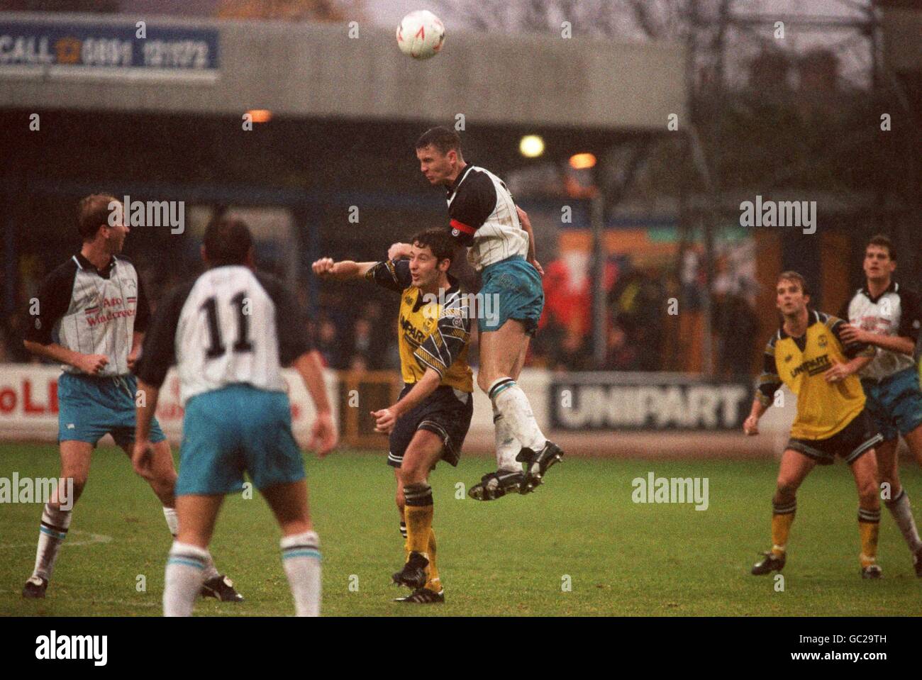 Derby countys michael forsyth leaps above oxford uniteds nick cusack hi ...