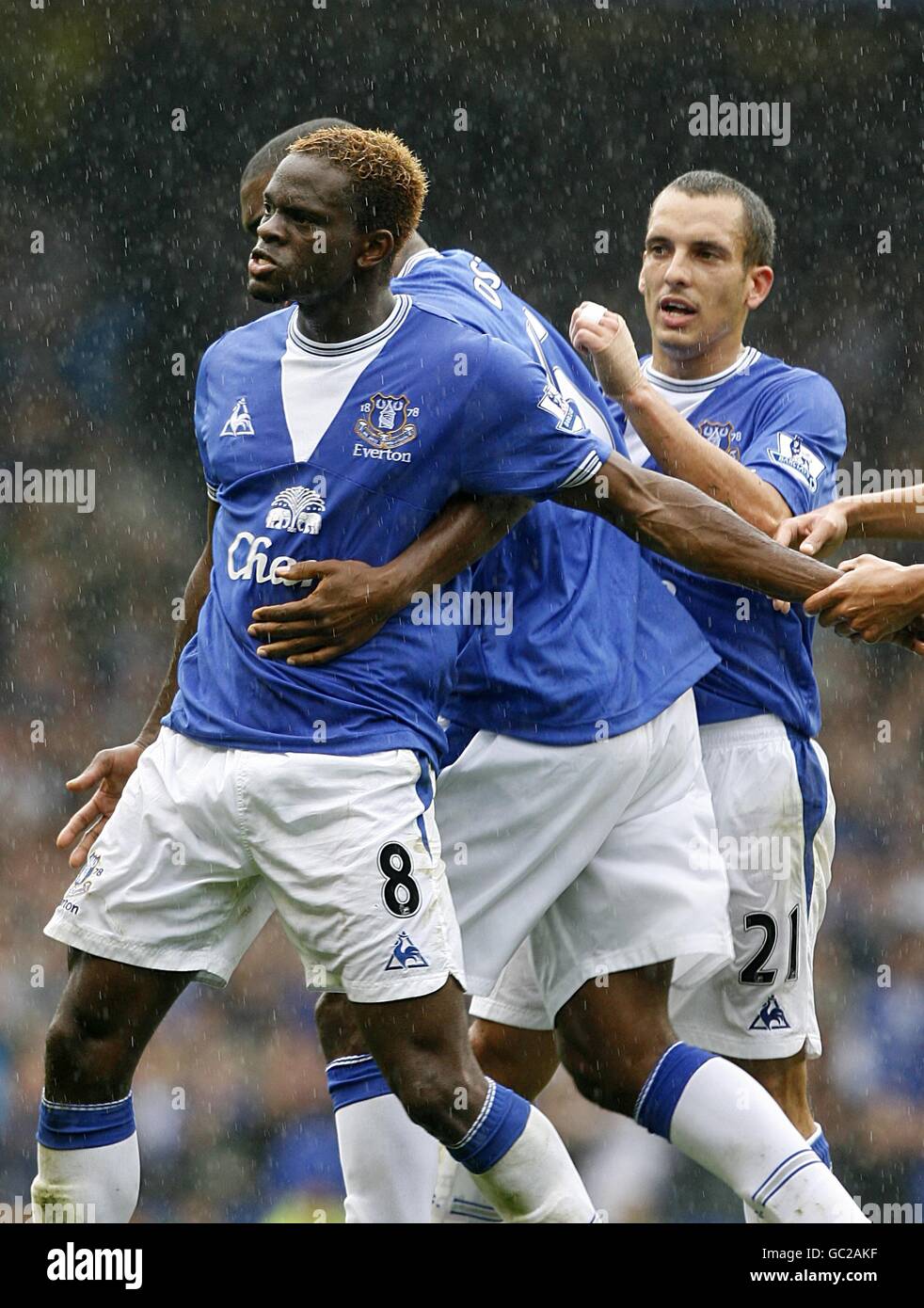 Everton's Louis Saha (left) is congratulated by his team mates after ...