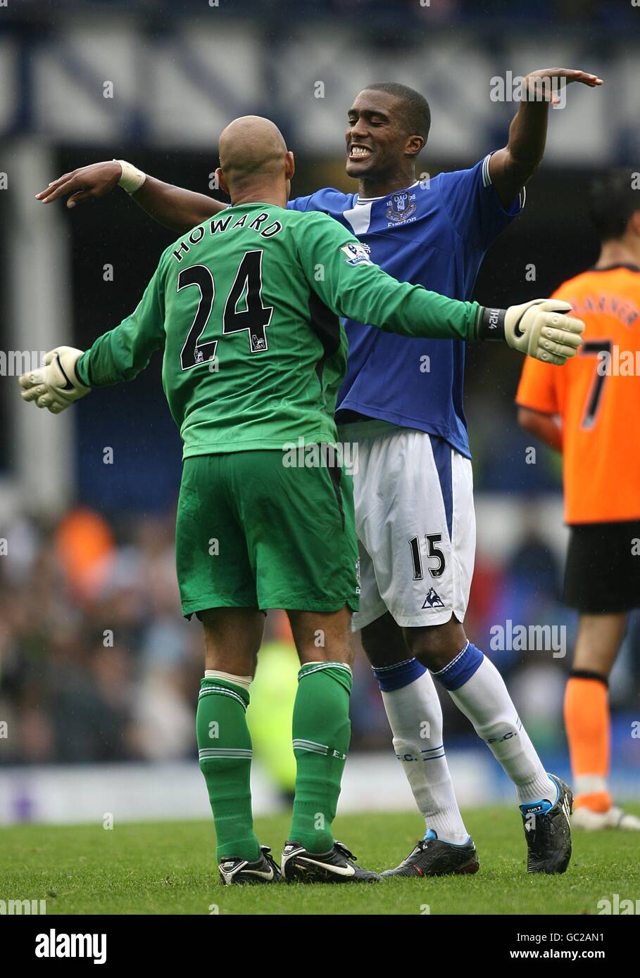 Everton goalkeeper Tim Howard and team mate Sylvain Distin celebrate ...