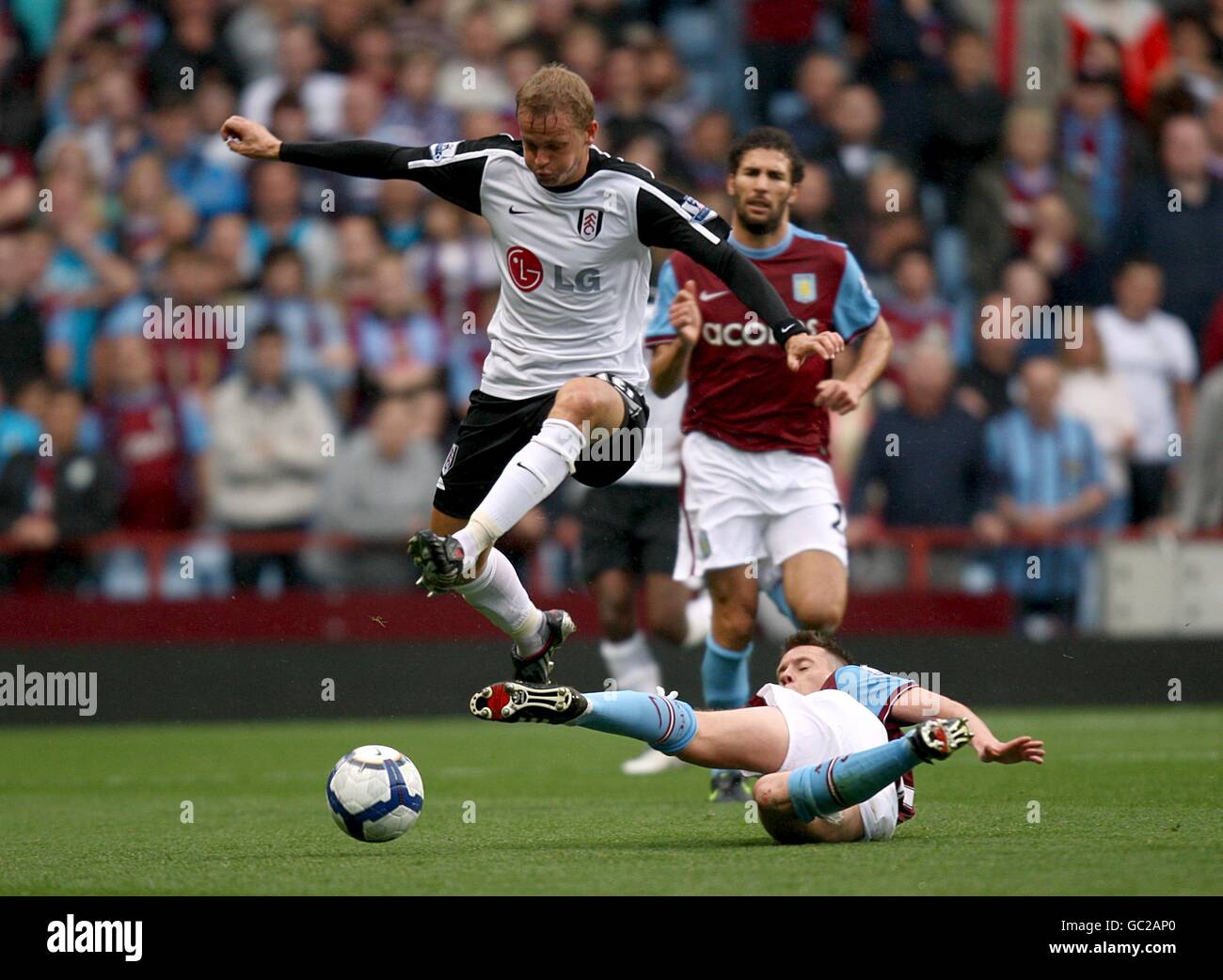 Fulham's Erik Nevland (left) and Aston Villa's Nicky Shorey (right ...