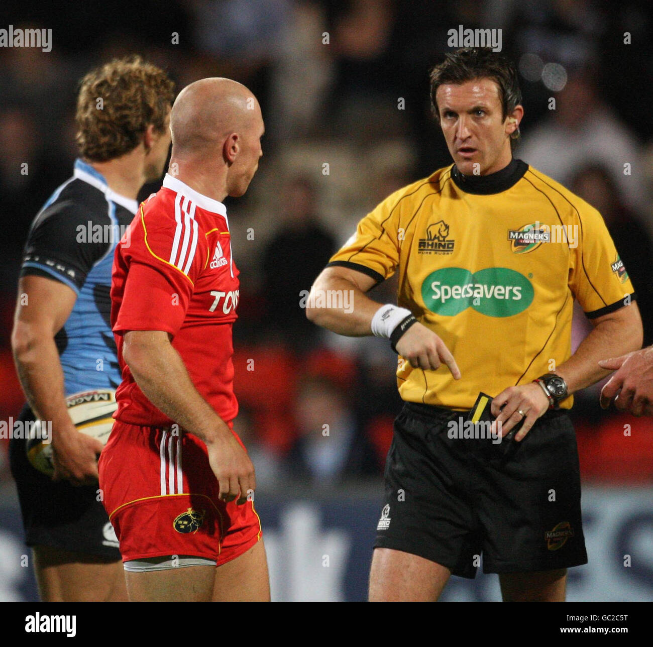 Munster's Peter Stringer (centre) is shown the yellow card during the ...
