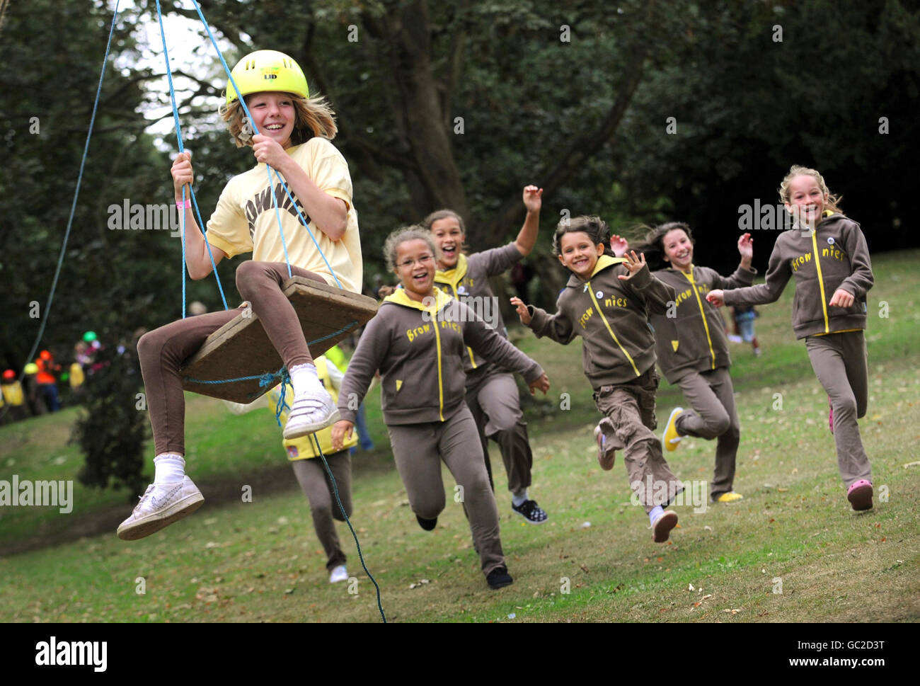Brownies enjoy the zip-wire activity at the Girl Guiding UK's Centenery ...