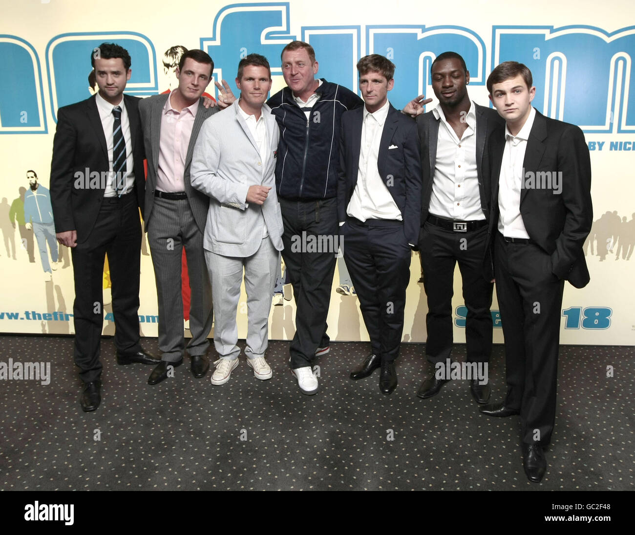 Director Nick Love (light blue suit) with members of the cast and ...