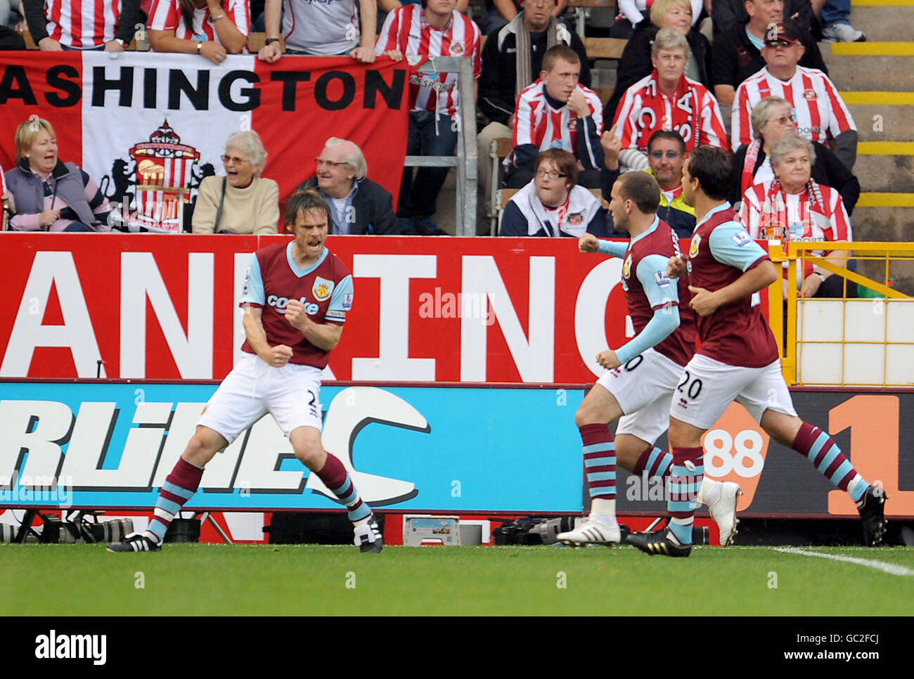 Burnley's Graham Alexander (left) celebrates scoring the opening goal ...