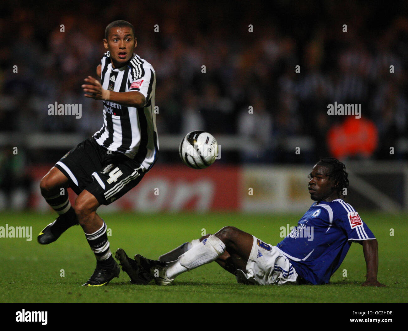 Newcastle United's James Tavernier holds off a challenge from ...