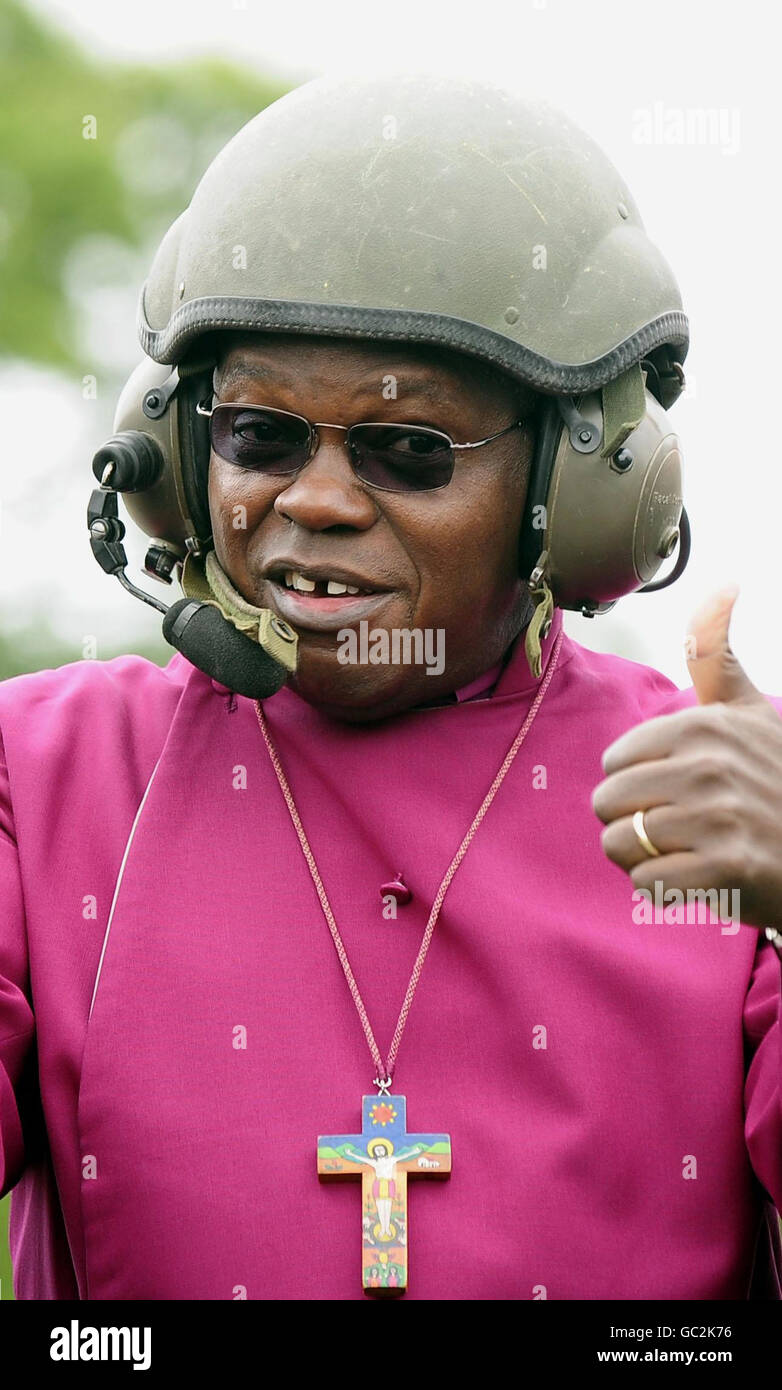 The Archbishop of York Dr John Sentamu puts on an army helmet as he is ...