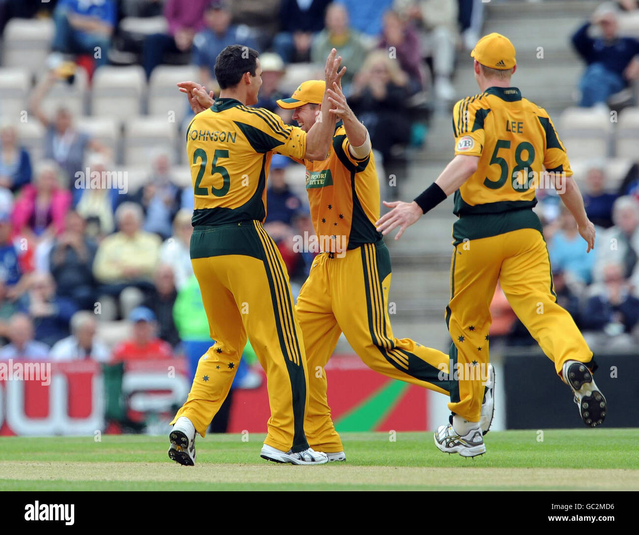 Australia's Mitchell Johnson (left) celebrates taking the wicket of ...