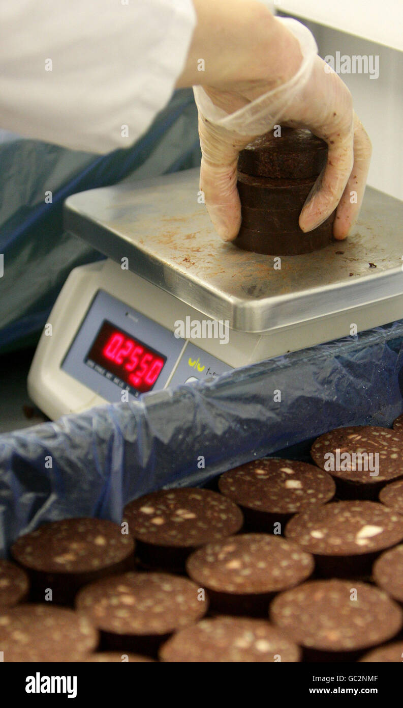 Staff at The Real Lancashire Black Pudding Company producing the ...