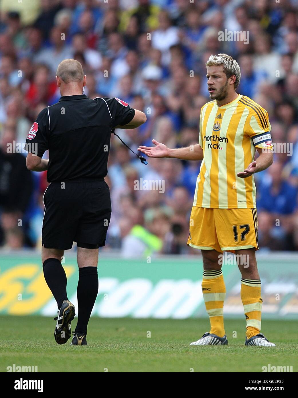 Newcastle United's Alan Smith (right) reacts after being shown a yellow ...