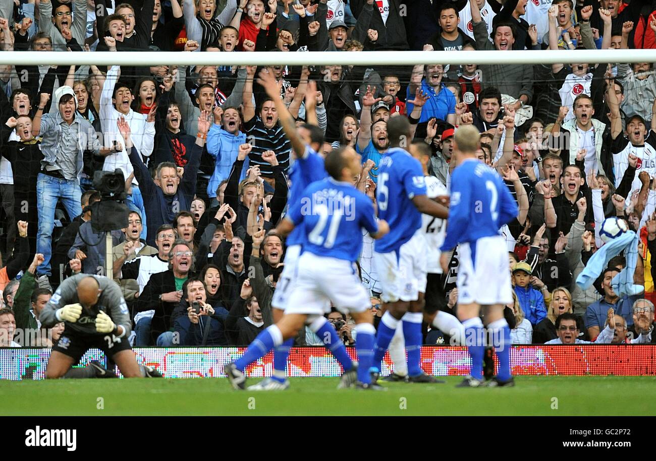 Everton goalkeeper Tim Howard (left) is beaten by a deflected shot by ...