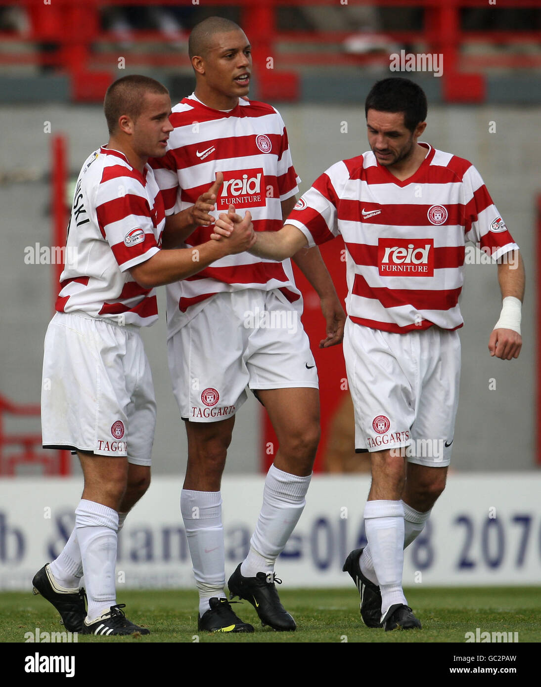 Hamilton's Marc Antoine-Curier (centre) celebrates scoring their second ...