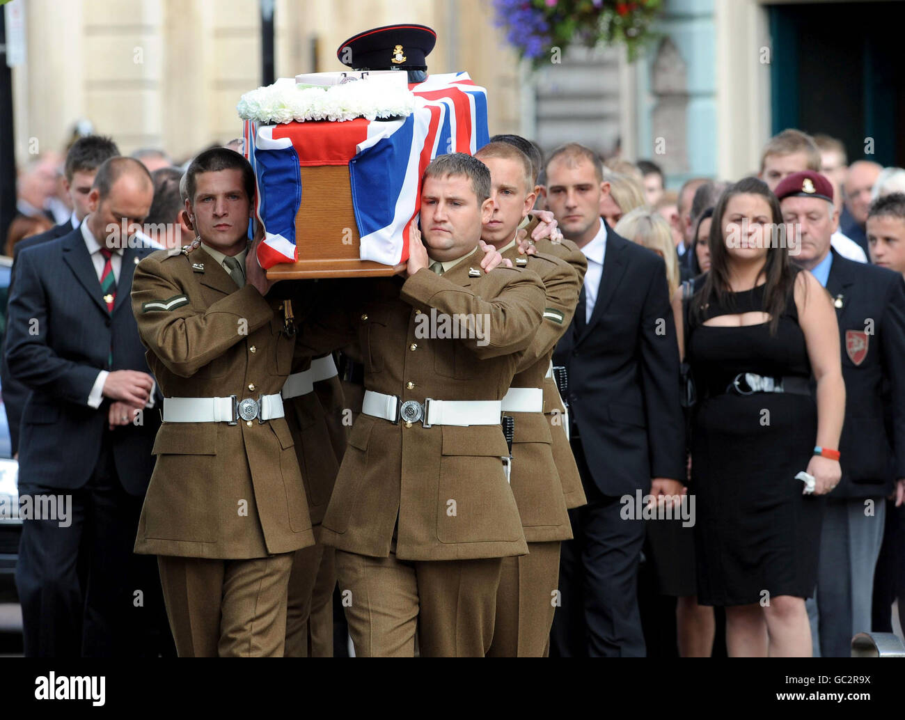 Mourners follow the coffin of Private Johnathon Young at his funeral at ...