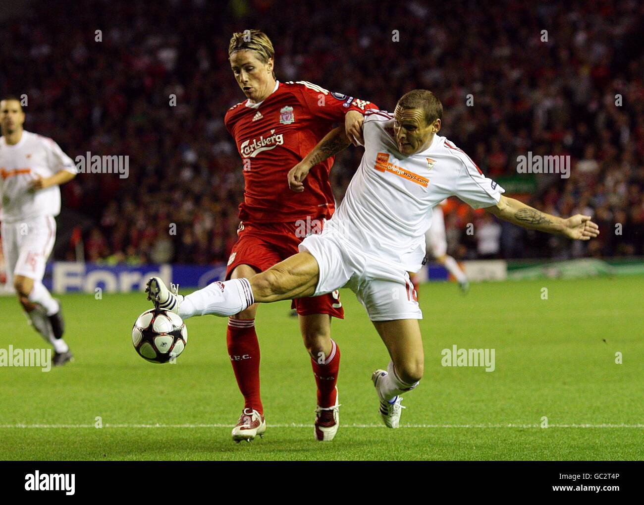 Liverpool's Fernando Torres (left) and Debrecen's Laszlo Bodnar battle ...