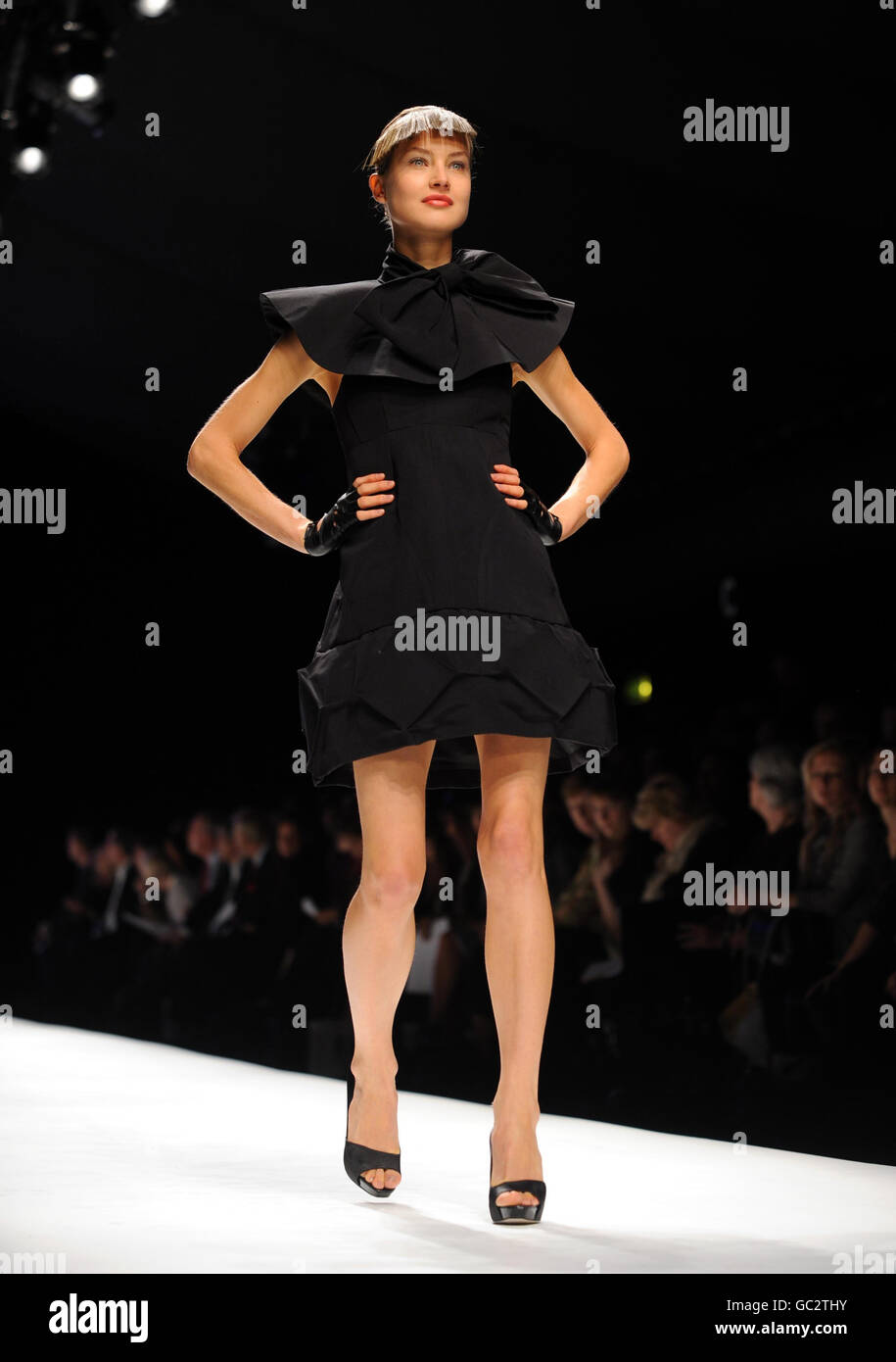 A model wears a creation by Paul Costello, the first to show his ...