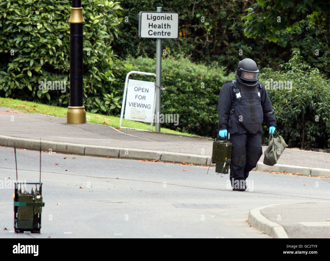 An Army bomb disposal expert prepares to examine a suspect device on ...