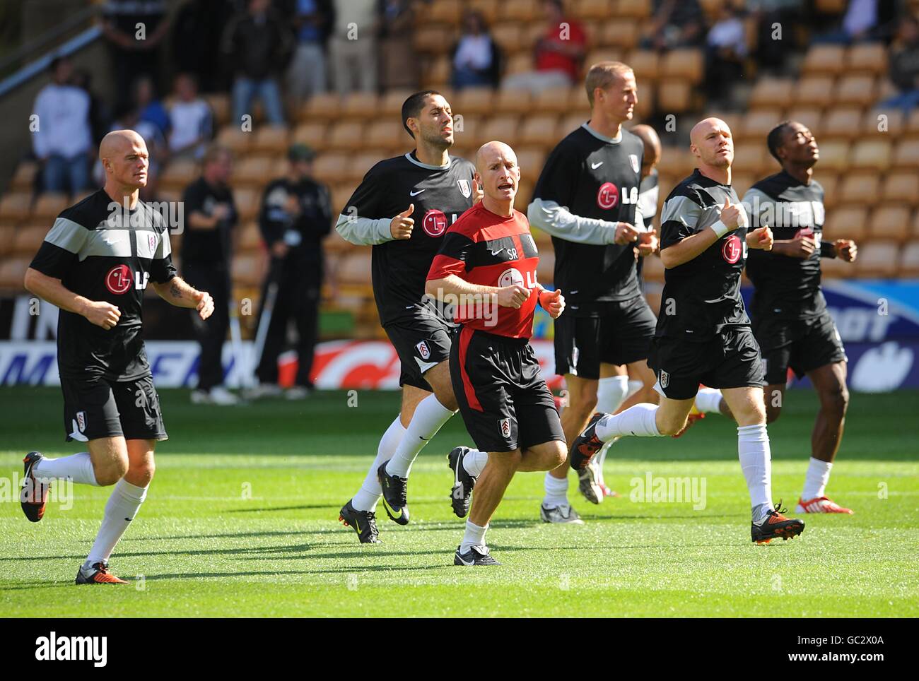 The Fulham players take part in the pre-match warm up Stock Photo - Alamy