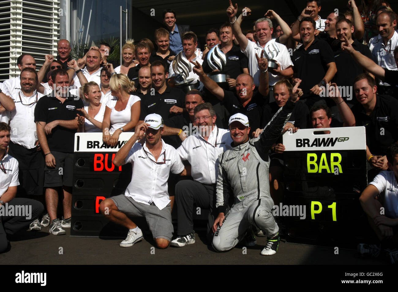 The Brawn GP team celebrate their 1-2 finish in the Italian Grand Prix ...