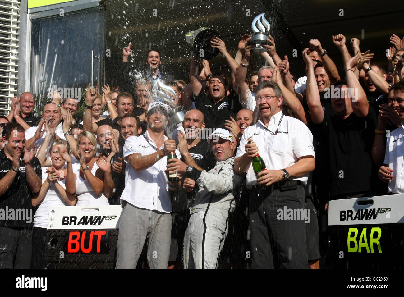 The Brawn GP team celebrate their 1-2 finish in the Italian Grand Prix ...