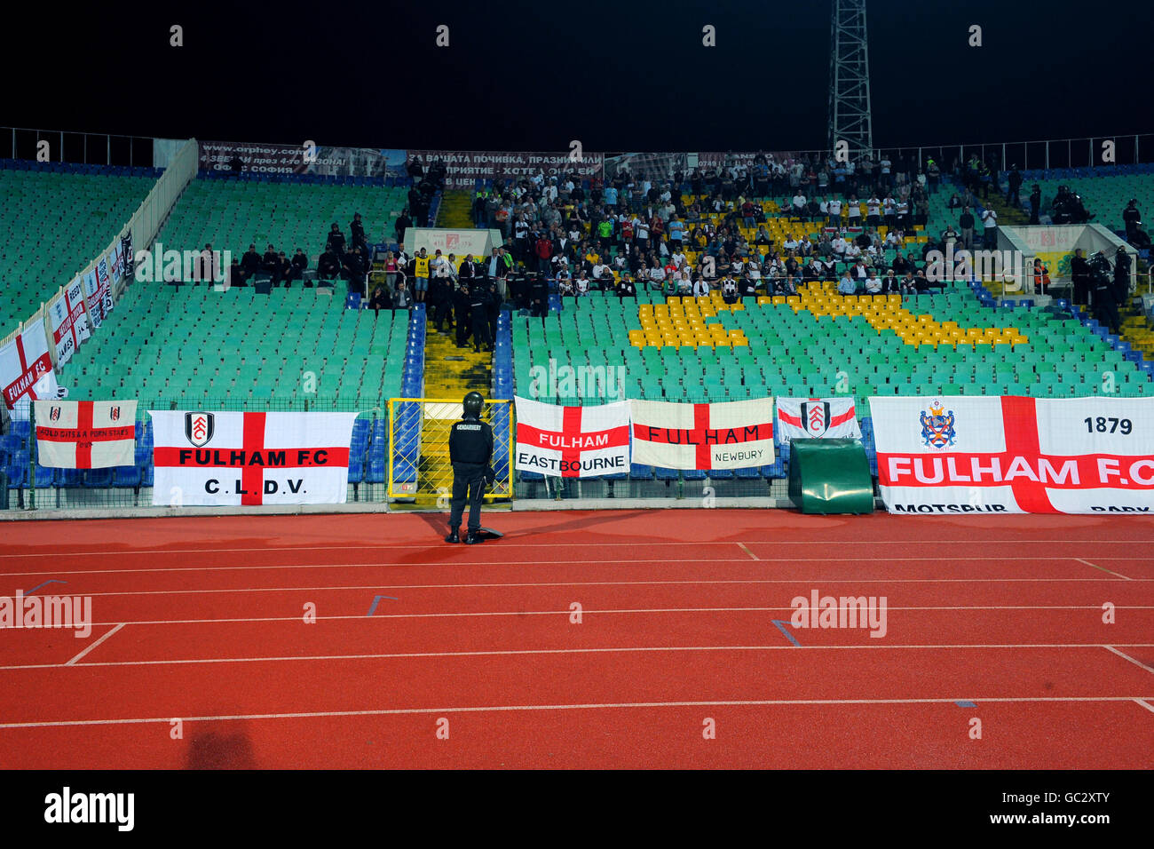 Fulham fans cheer on their side in the stand hi-res stock photography ...