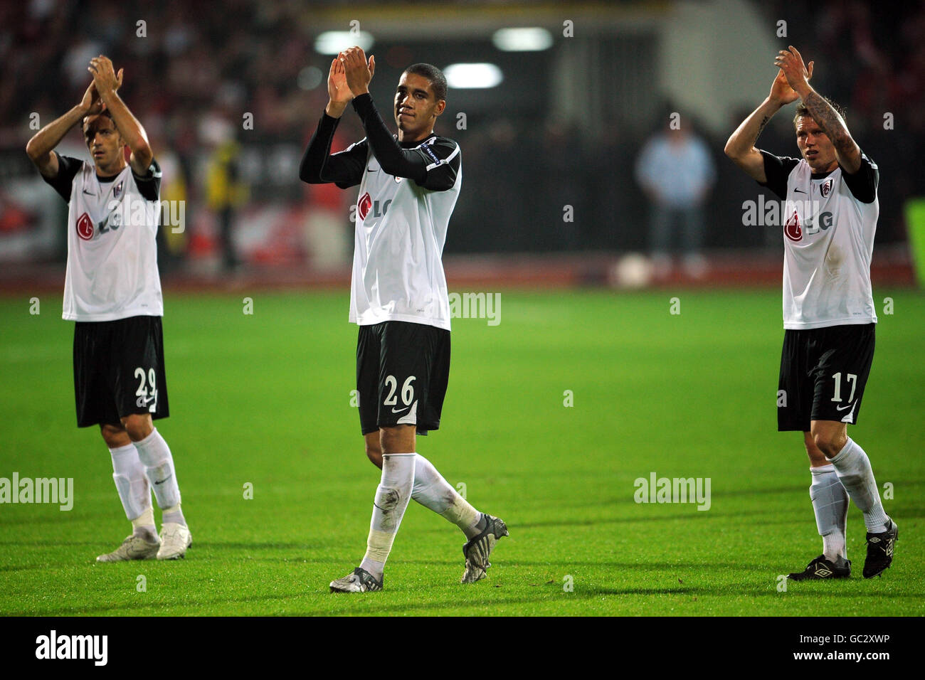 (left to right) Fulham's Simon Davies, Chris Smalling and Bjorn Helge ...