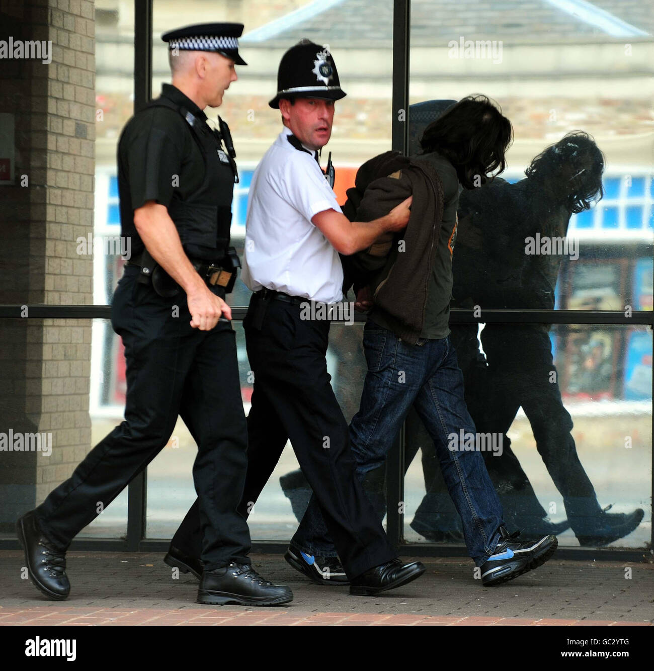 Christopher Burgess is led away by police after a scuffle at Lincoln ...