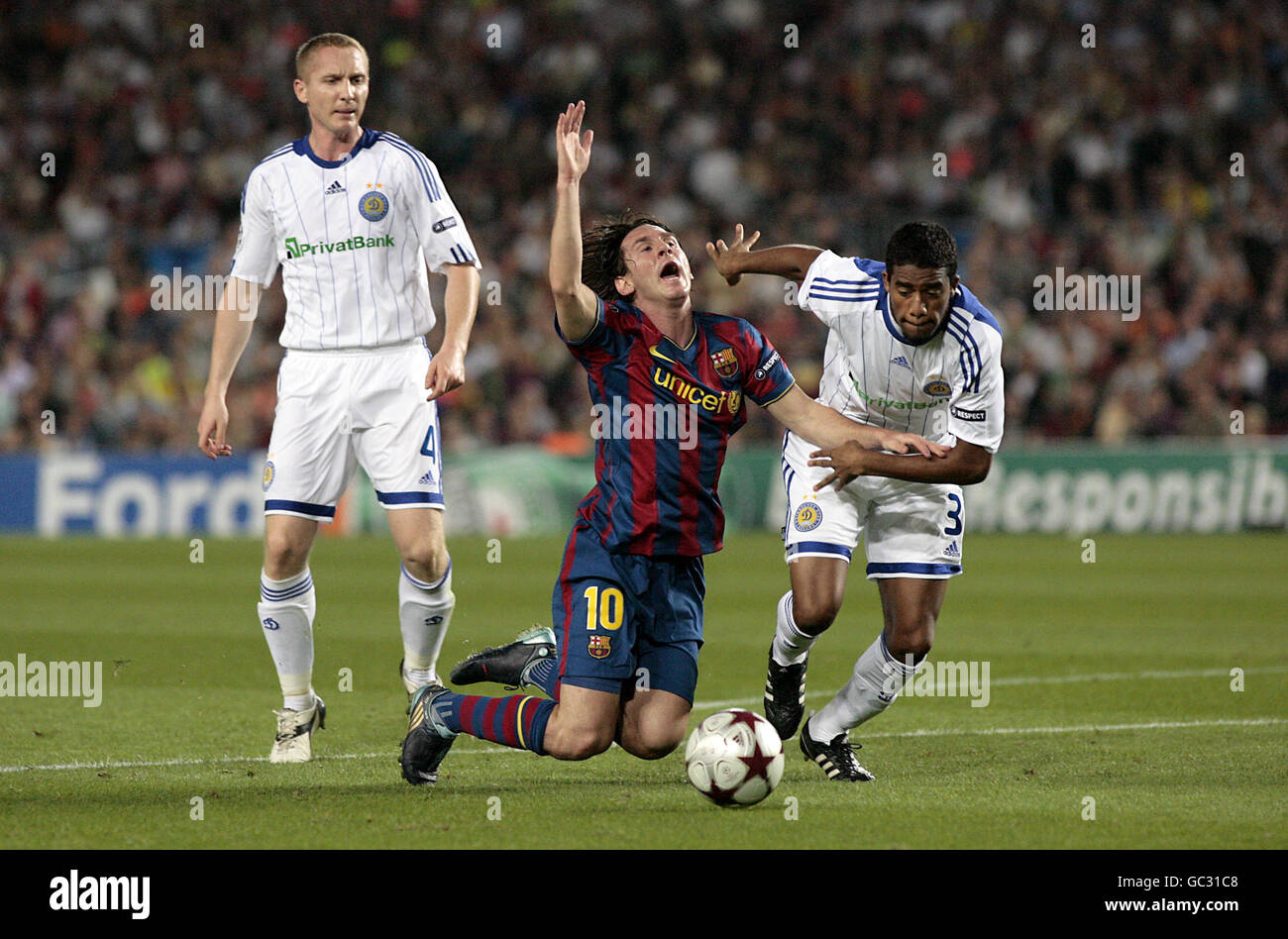 Barcelonas lionel messi is fouled by dynamo kievs betao hi-res stock ...