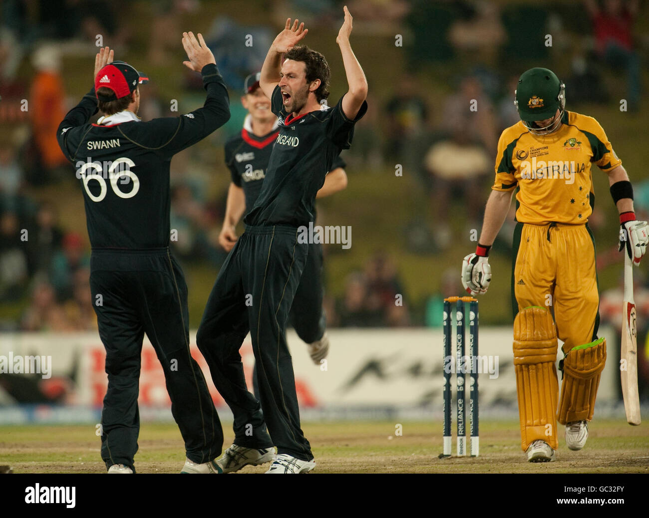 England's Graham Onions (c) celebrates dismissing Australia's Tim Paine ...