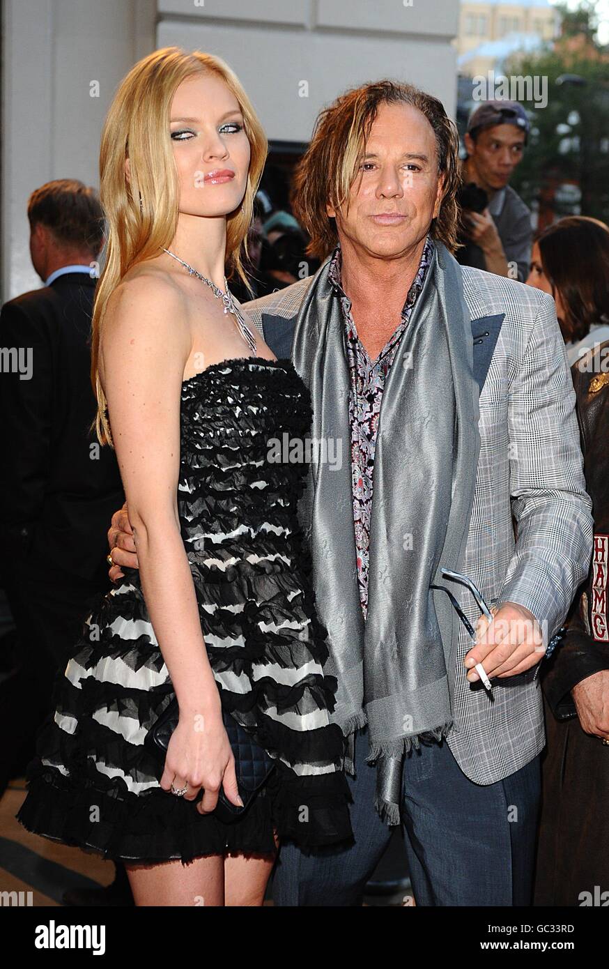 Actor Mickey Rourke and his model friend Elena arriving for the 2009 GQ ...