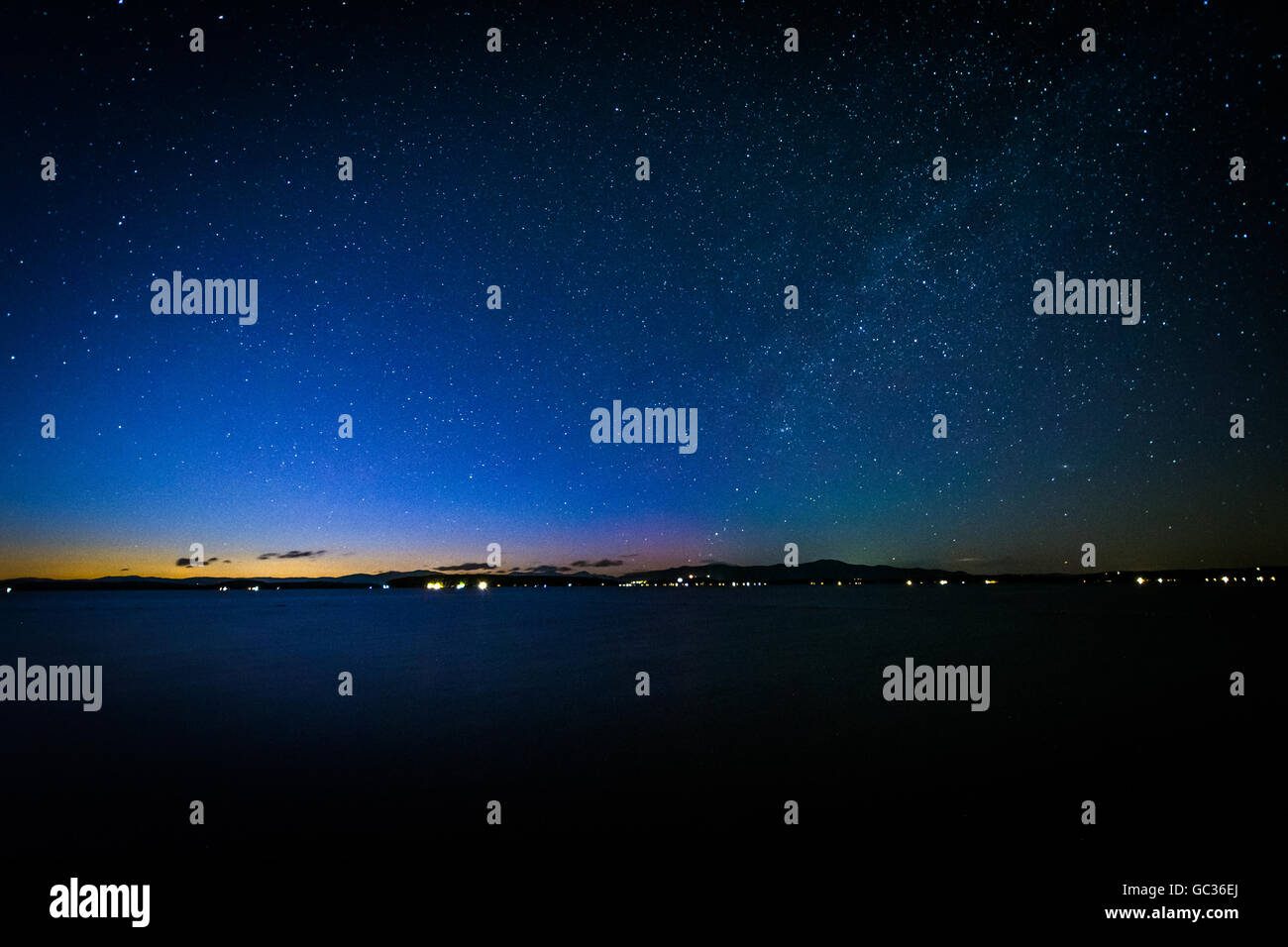 The Milky Way over Lake Winnipesaukee at night, at Ellacoya State Park ...