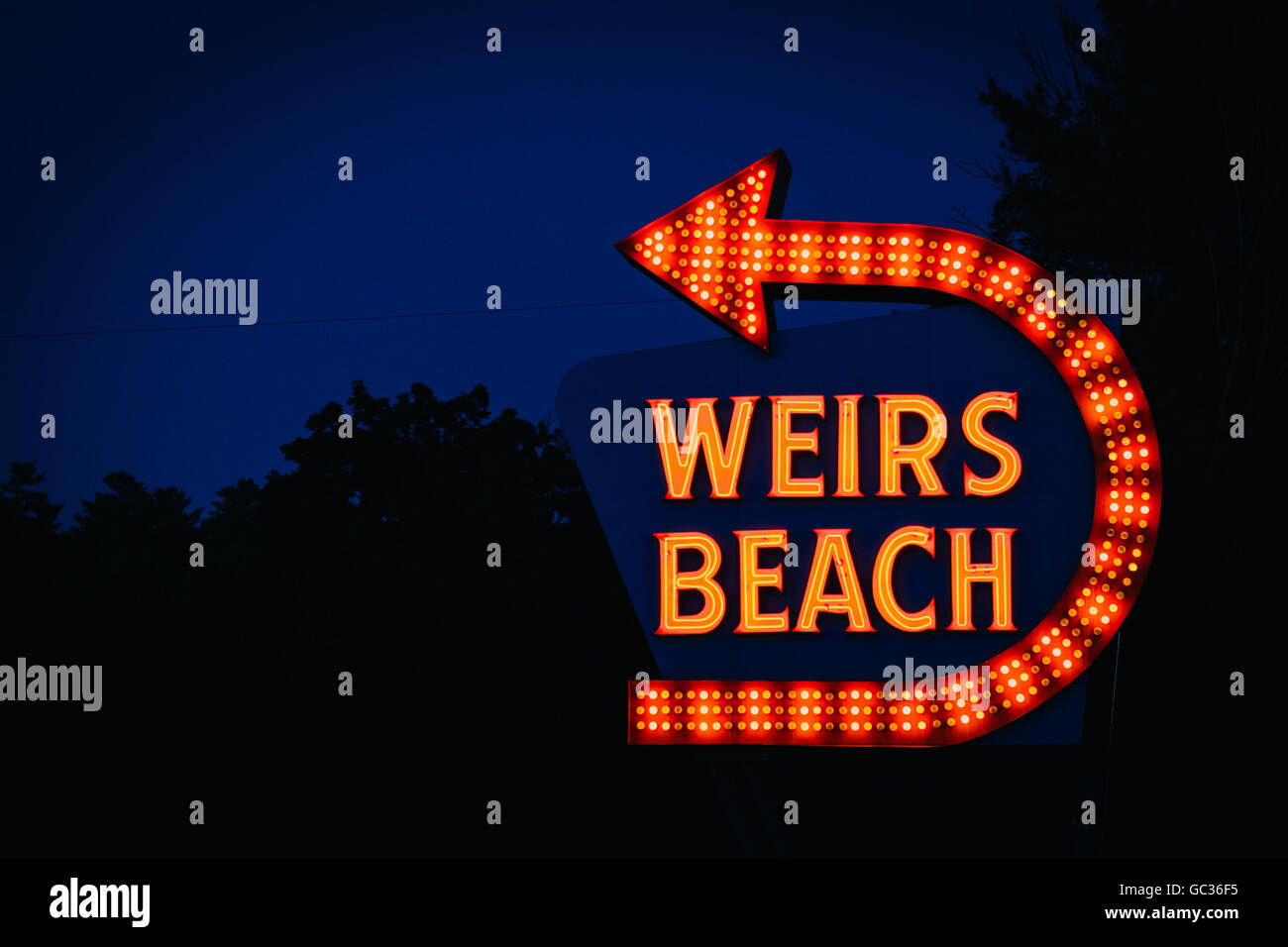 The Weirs Beach sign at night, in Laconia, New Hampshire Stock Photo ...