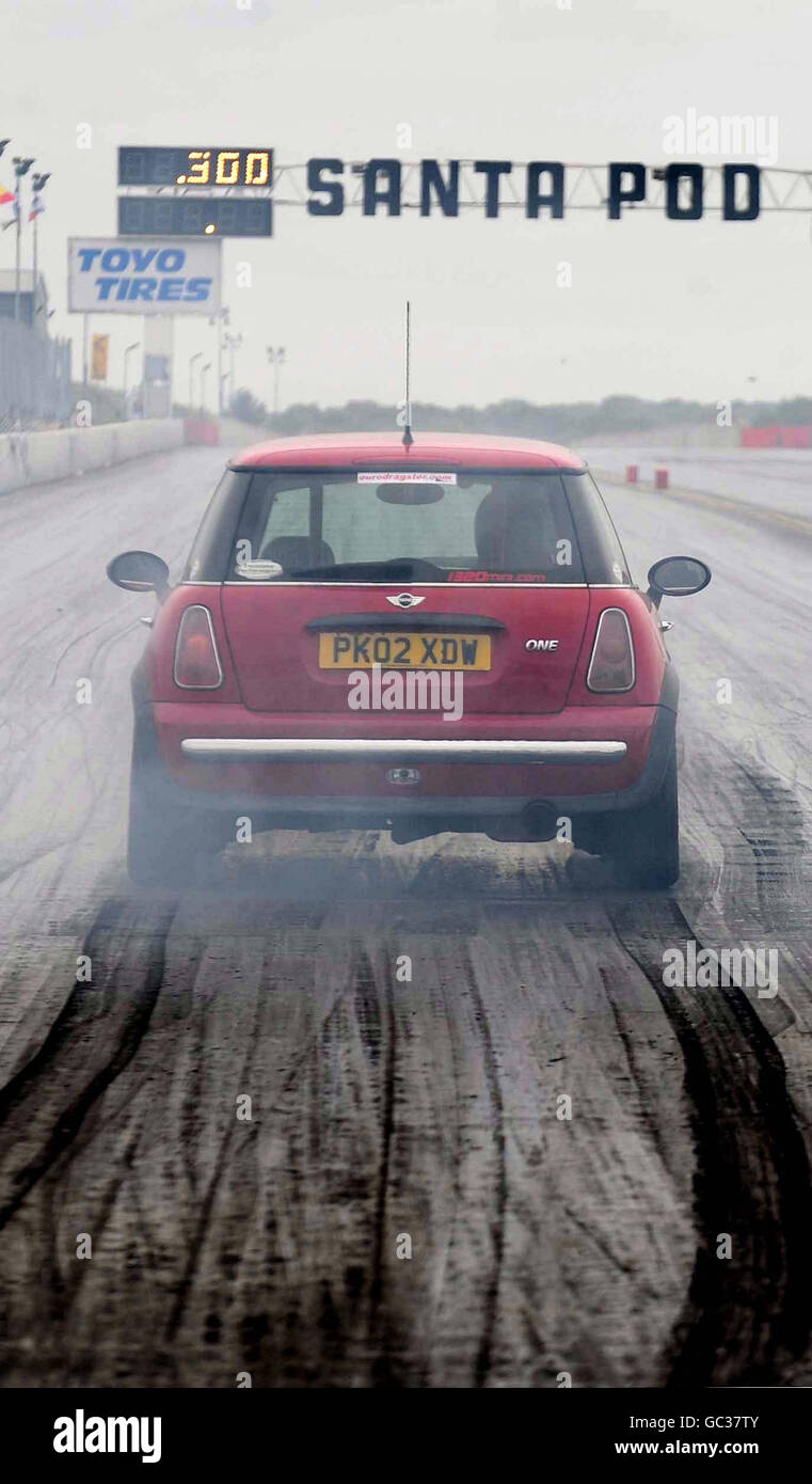 A Mini driver prepares to race against a UK police Subaru Impreza WRX ...