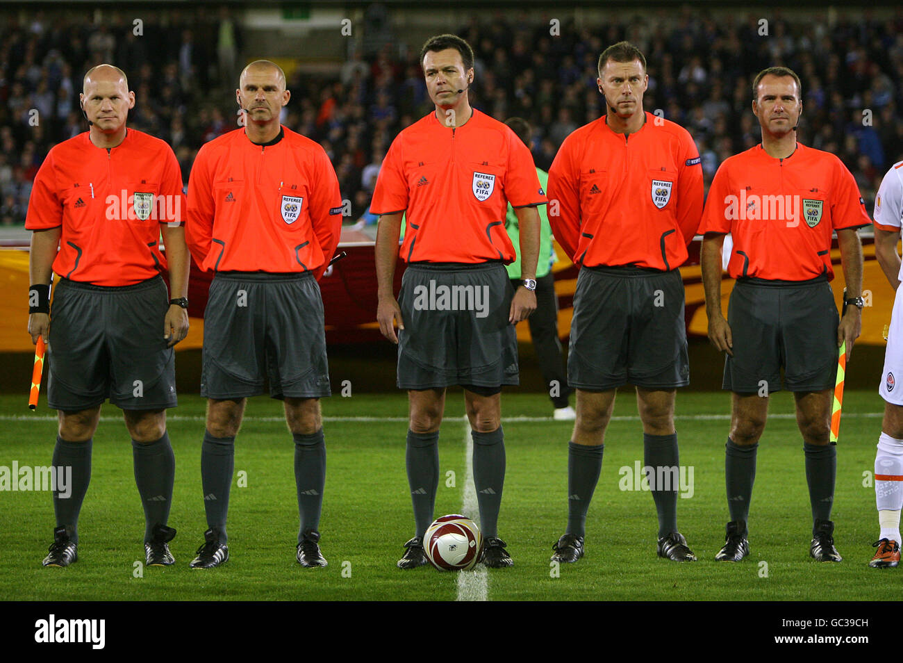 Match referee Martin Ingvarsson (centre) stands with his assistant ...