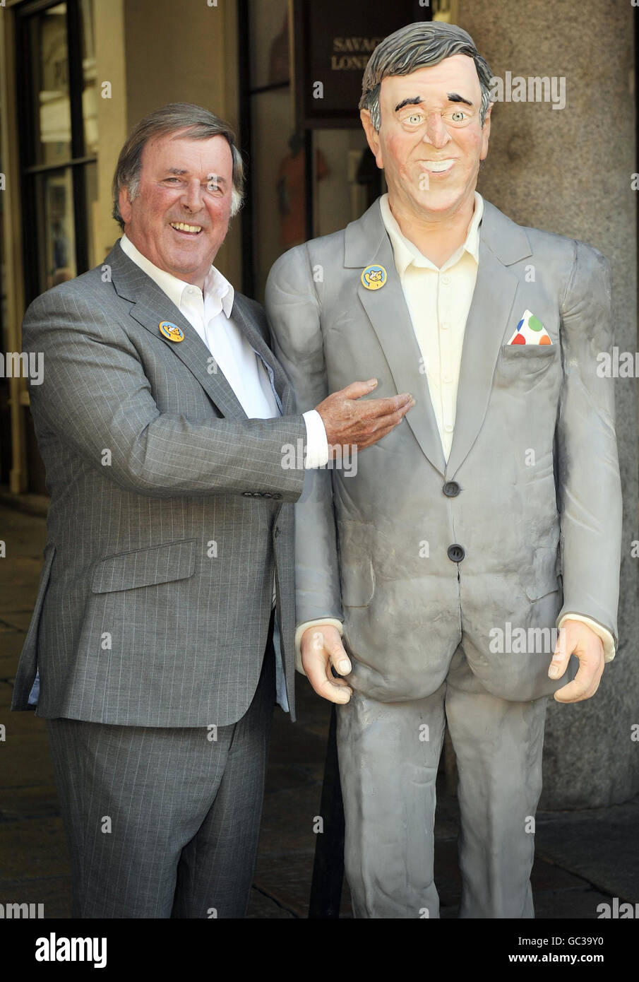 Sir Terry Wogan is presented with a life-size cake replica of himself ...