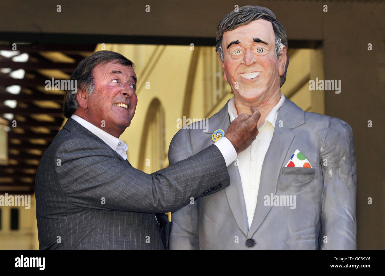 Sir Terry Wogan is presented with a life-size cake replica of himself ...