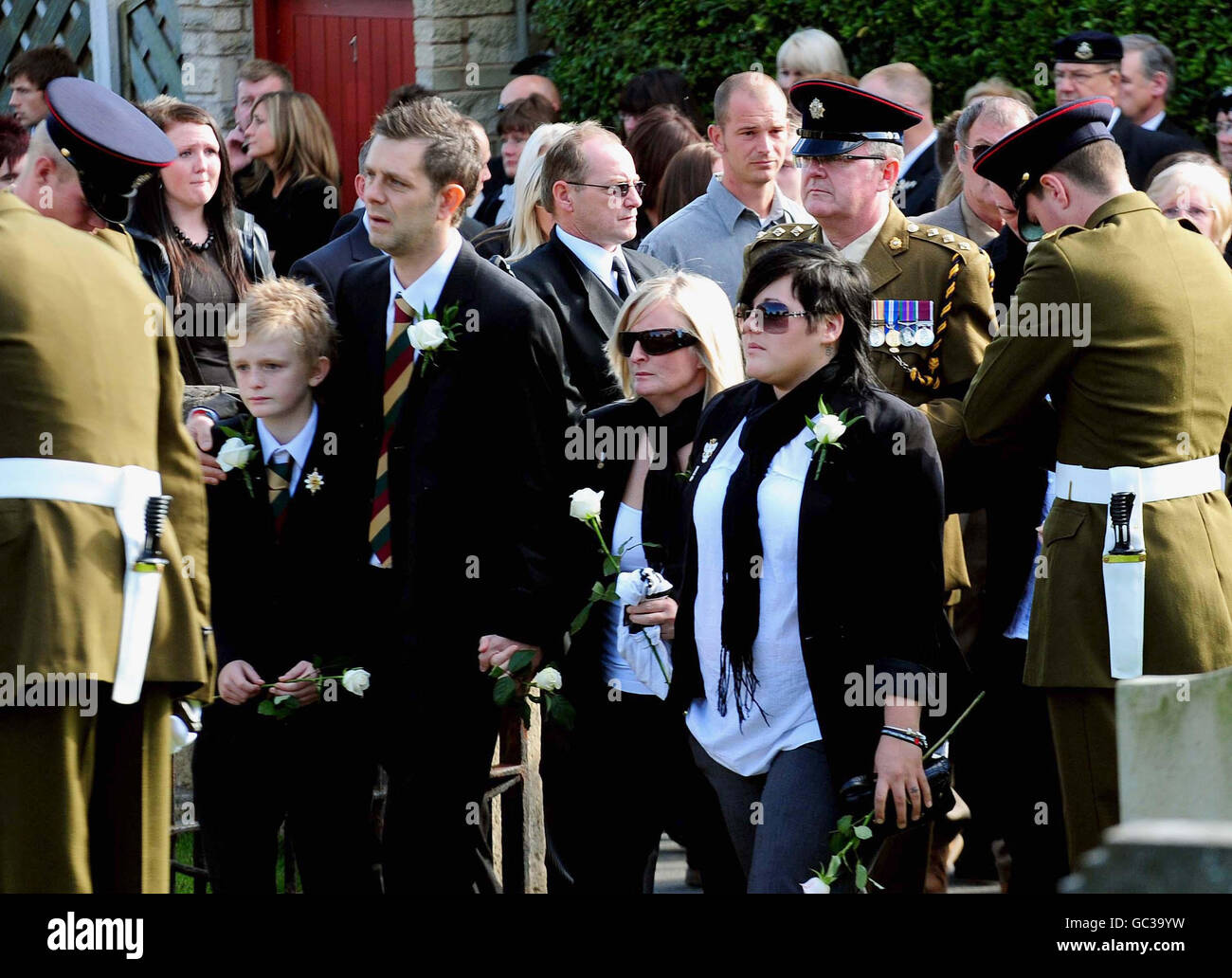 (Centre left to right) Private Gavin Elliott's brother Joshua, 11 ...