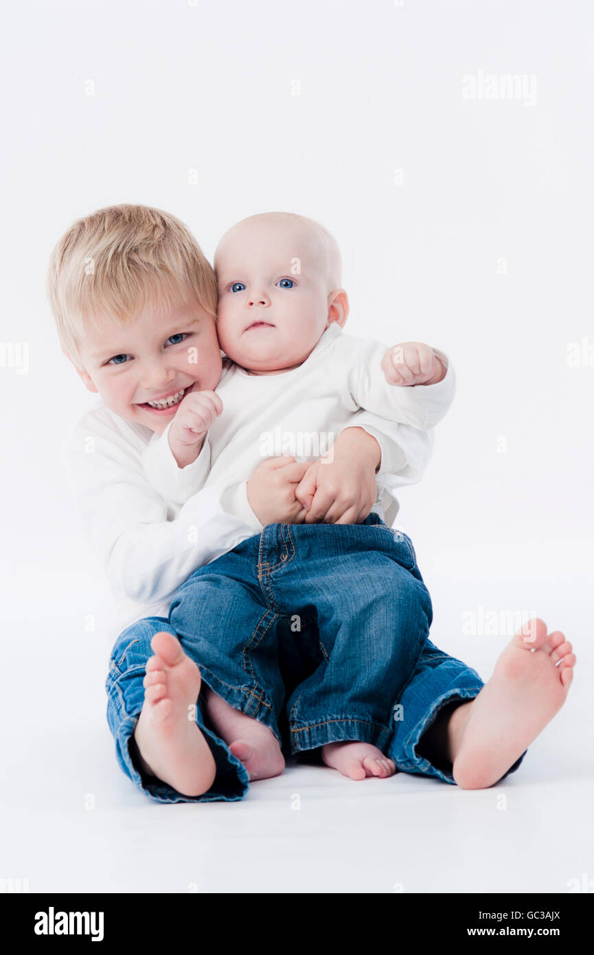 Siblings, brother with his little sister Stock Photo - Alamy
