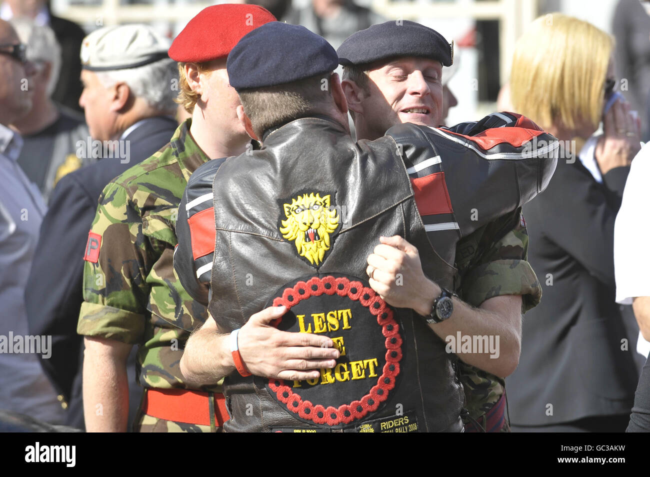 Sergeant Phil Reed gets a hug from a Royal British Legion rider, made ...